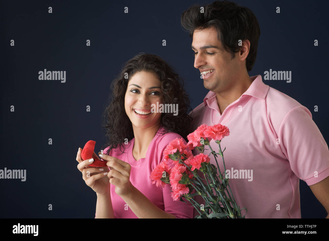 Man giving flower to a woman Stock Photo - Alamy