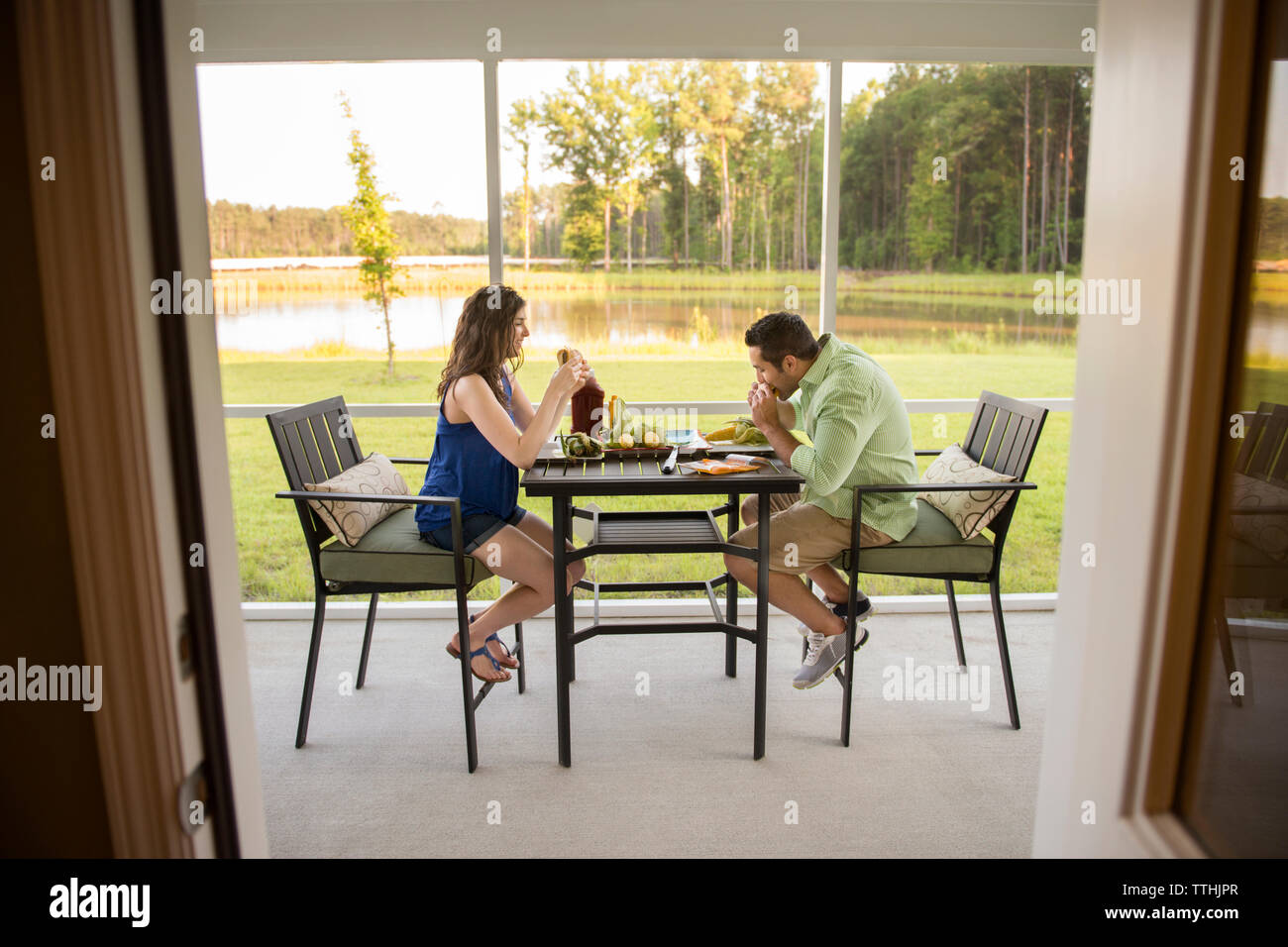 Man male woman female couple food eating table hi-res stock photography ...
