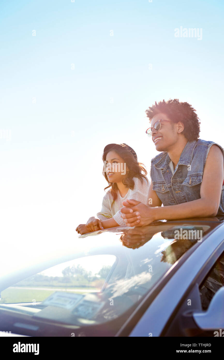 Group friends standing car on hi-res stock photography and images - Alamy