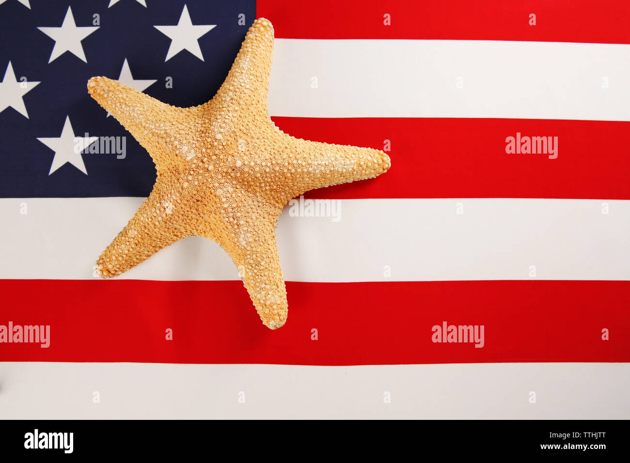 Labor day concept. Starfish on USA national flag background Stock Photo ...