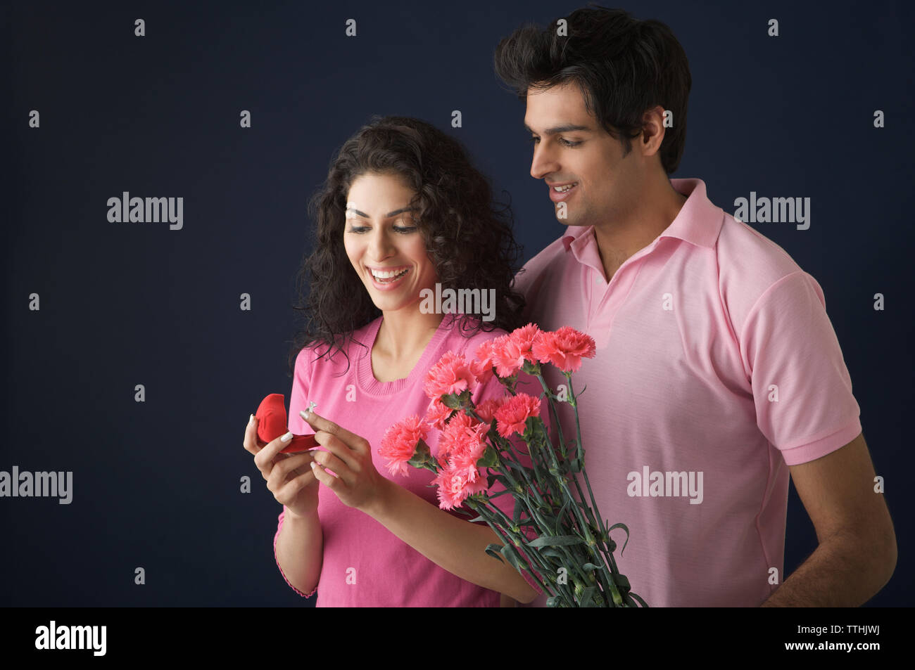 Man giving flower to a woman Stock Photo - Alamy