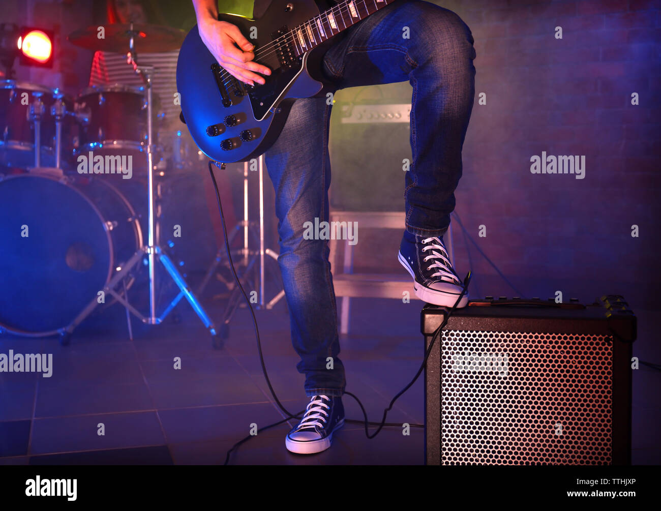 Musician's foot stepped on amplifier Stock Photo - Alamy