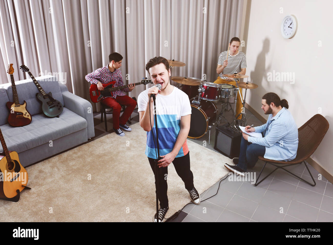 Music band performing in a recording studio Stock Photo - Alamy