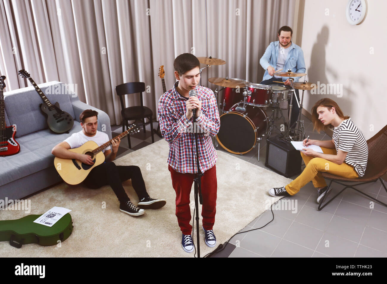 Music band performing in a recording studio Stock Photo - Alamy