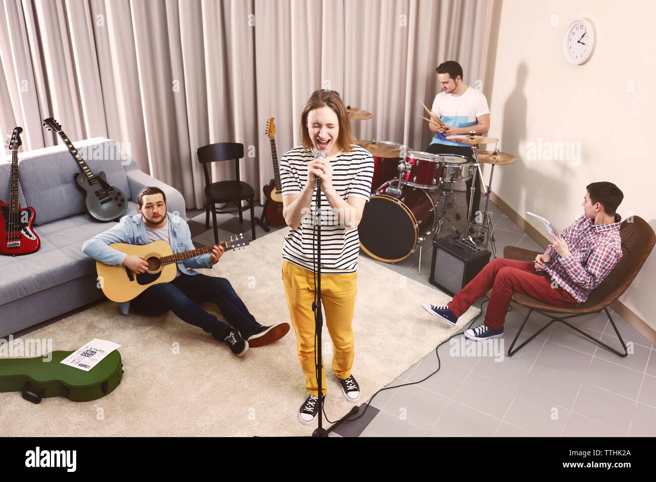 Music band performing in a recording studio Stock Photo - Alamy