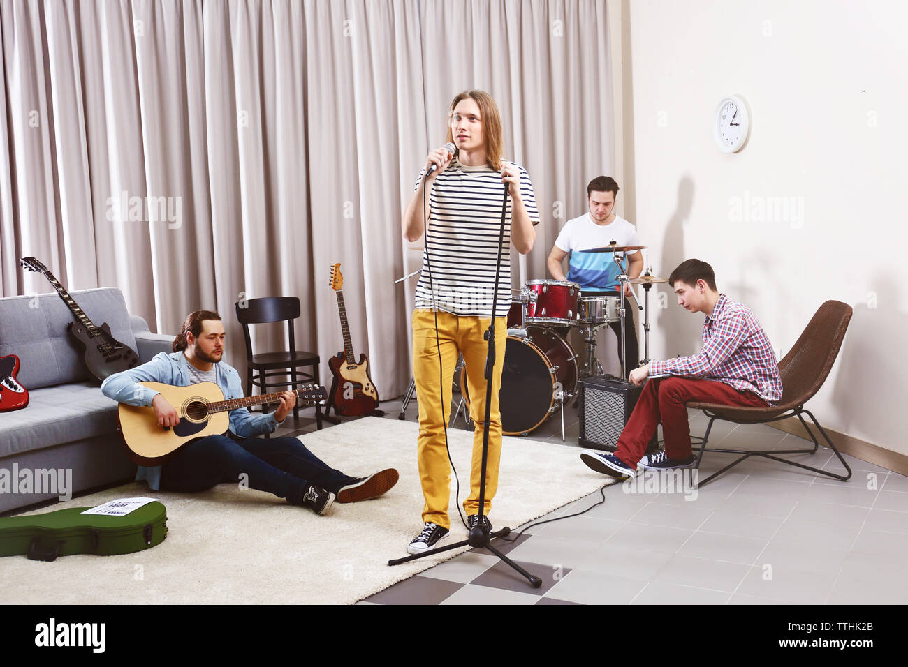 Music band performing in a recording studio Stock Photo - Alamy