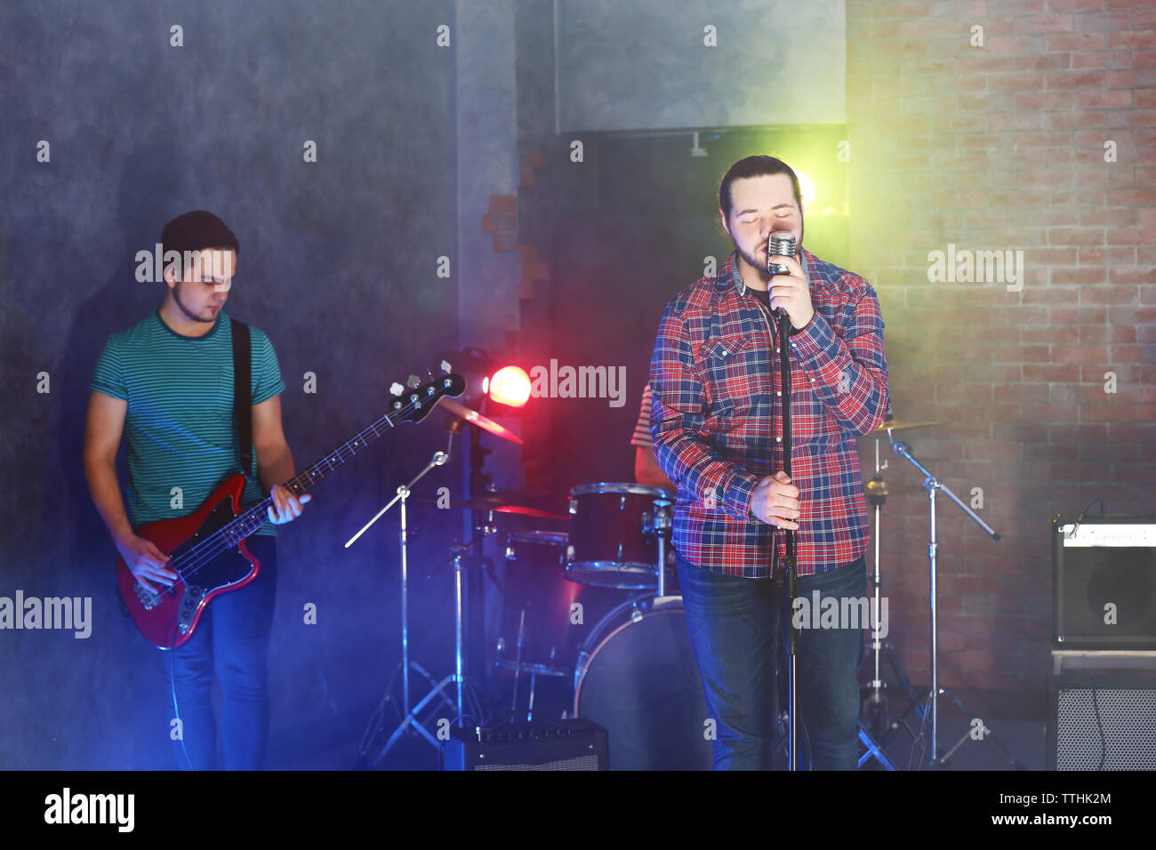 Music band performing on stage Stock Photo - Alamy
