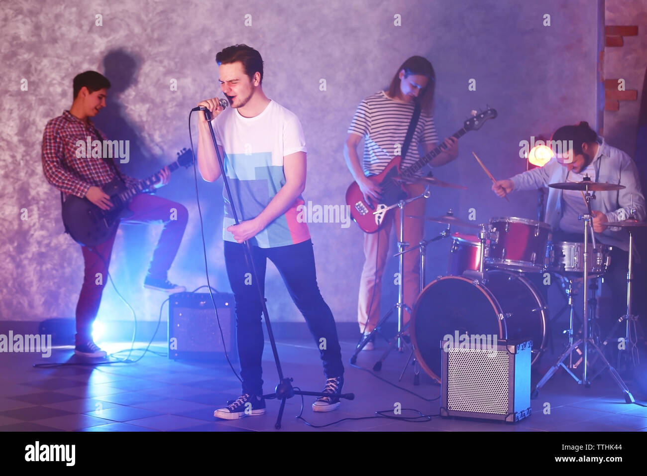Music band performing on stage Stock Photo - Alamy