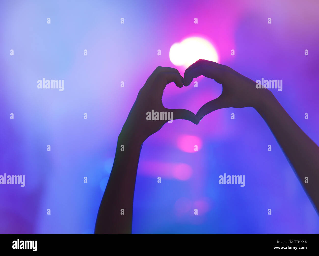 Heart shaped hands on a concert Stock Photo - Alamy