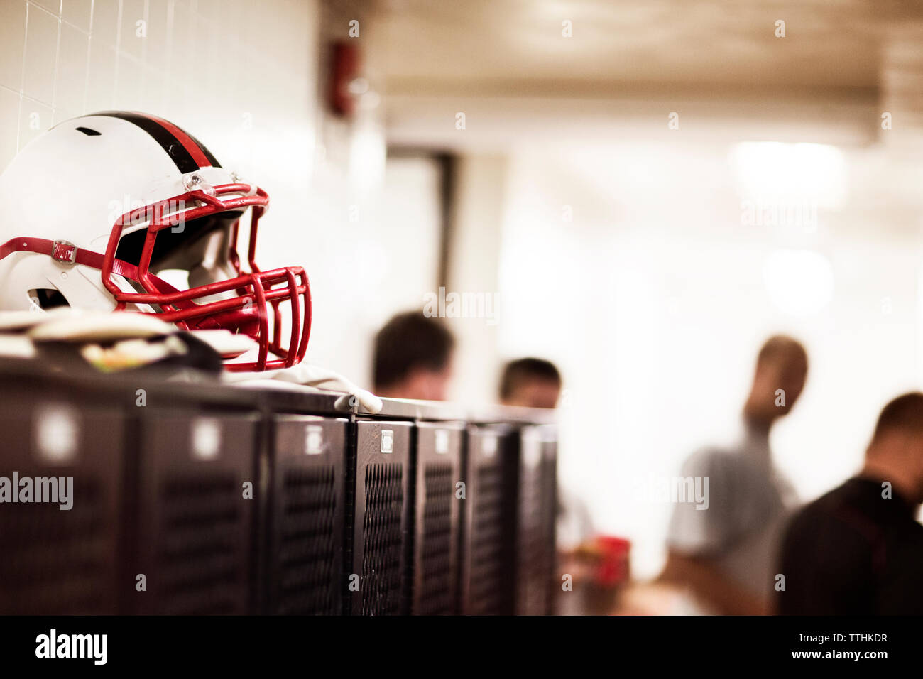Sports helmet on table in illuminated room Stock Photo - Alamy