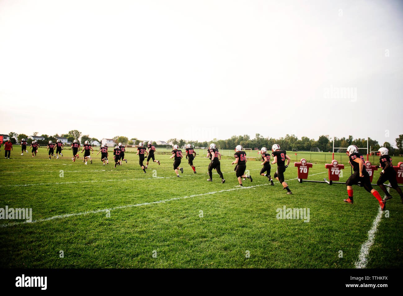 School uniform group running hi-res stock photography and images - Alamy