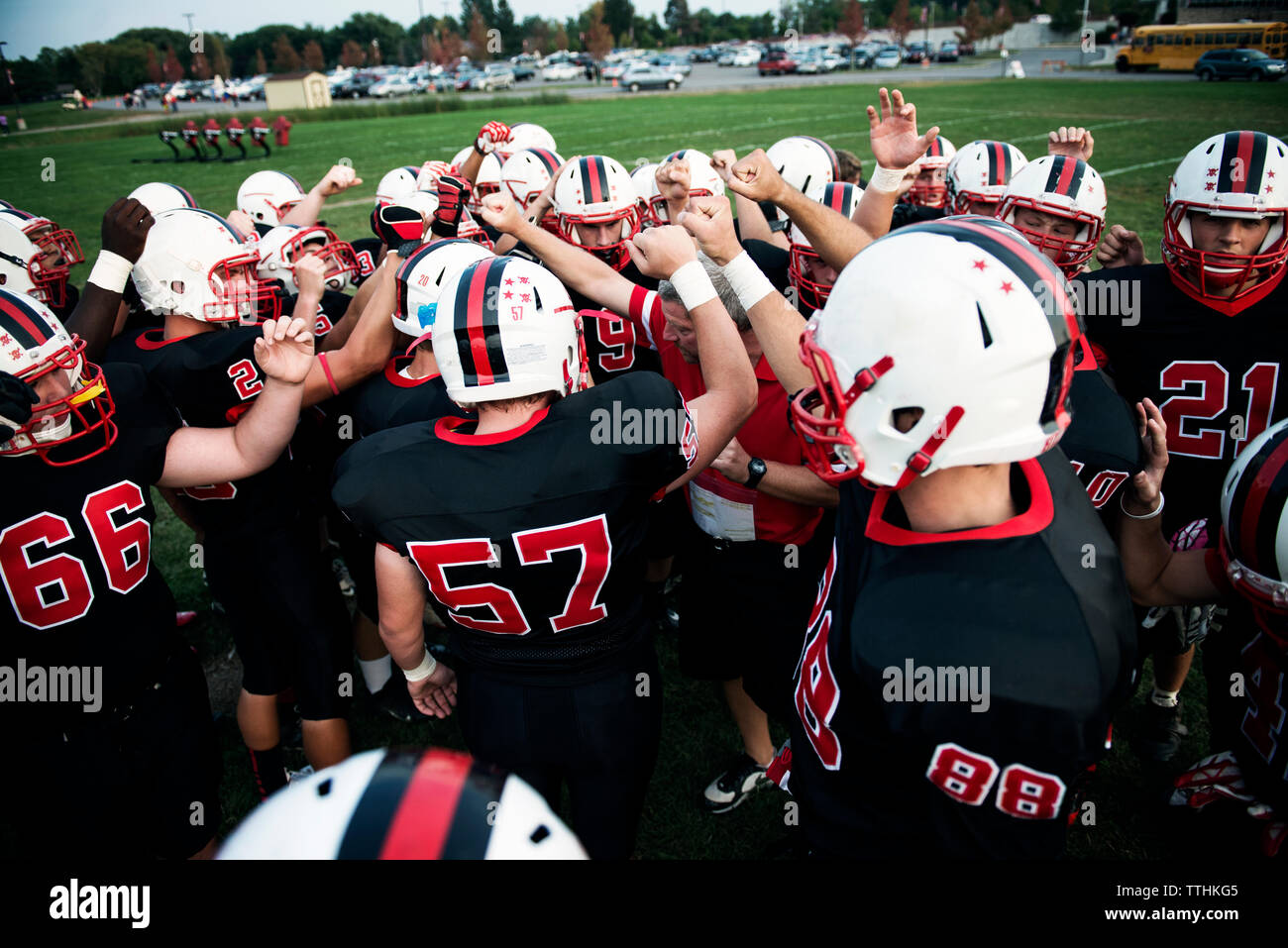 High angle view of male American football team cheering on field Stock ...