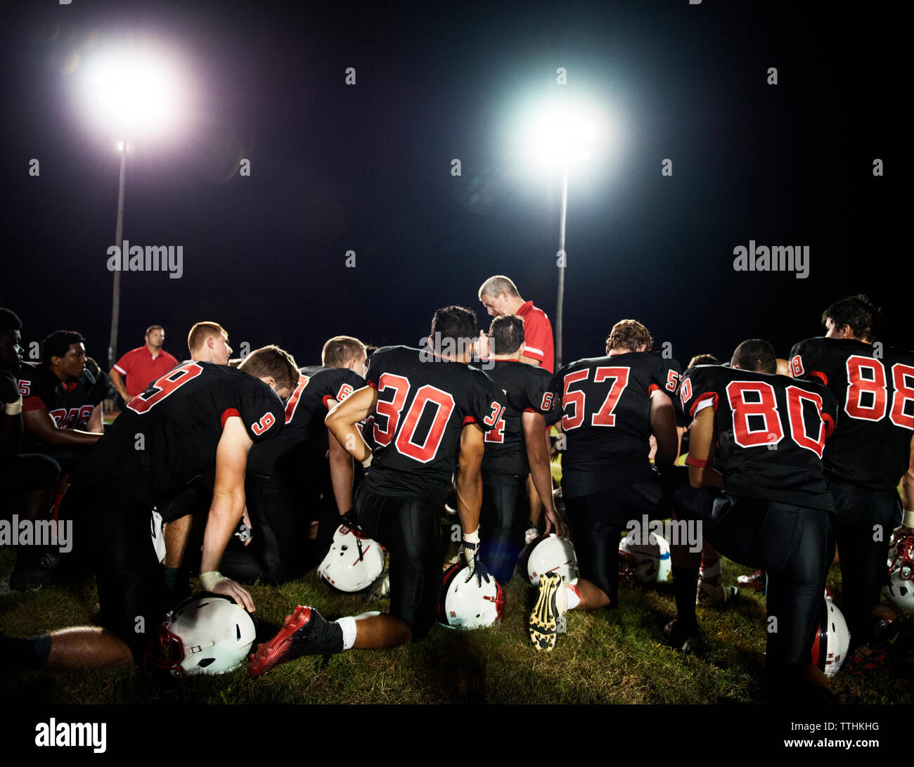 Kneeling man rear view hi-res stock photography and images - Alamy