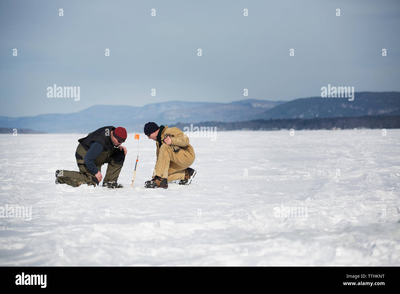 Ice fishing lake hi-res stock photography and images - Alamy