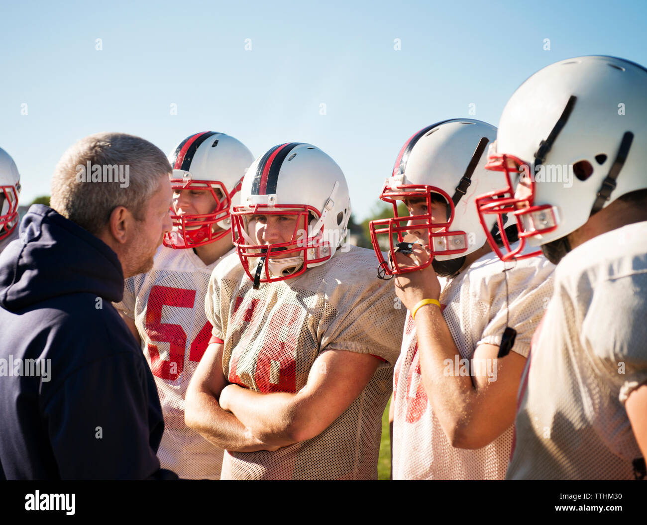 Football players and coach hi-res stock photography and images - Alamy