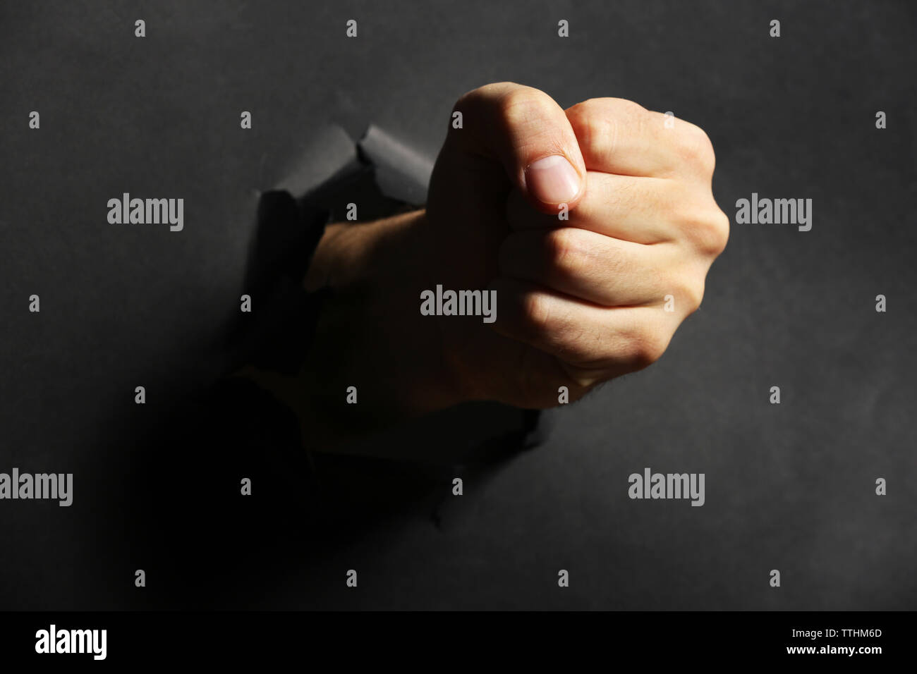 Fist punching on black hi-res stock photography and images - Alamy