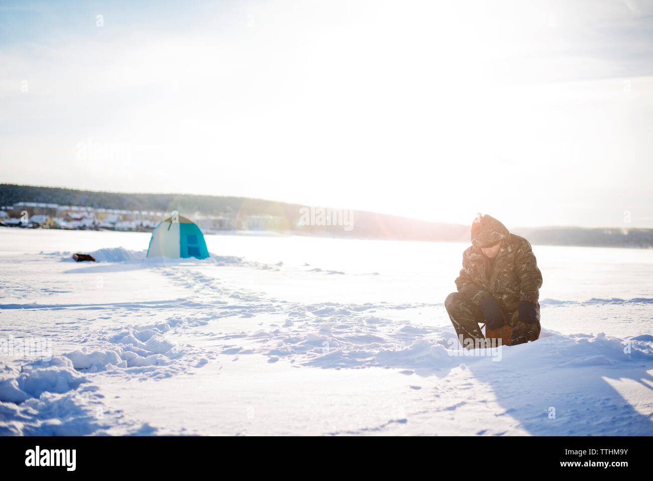 Man sitting on ice hi-res stock photography and images - Alamy
