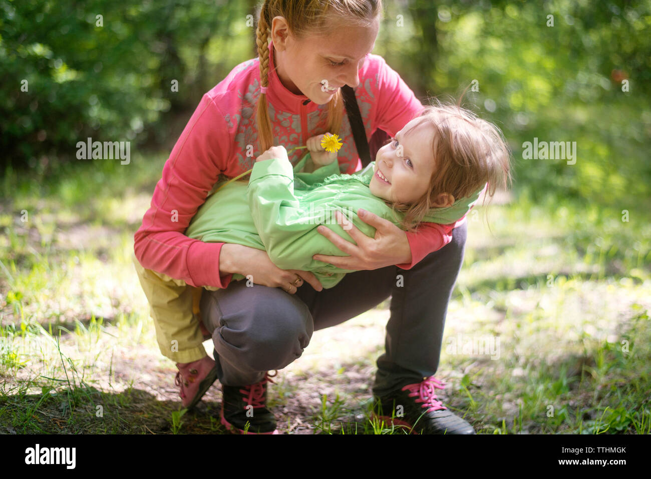 Childhood holding crouching bonding hi-res stock photography and images ...