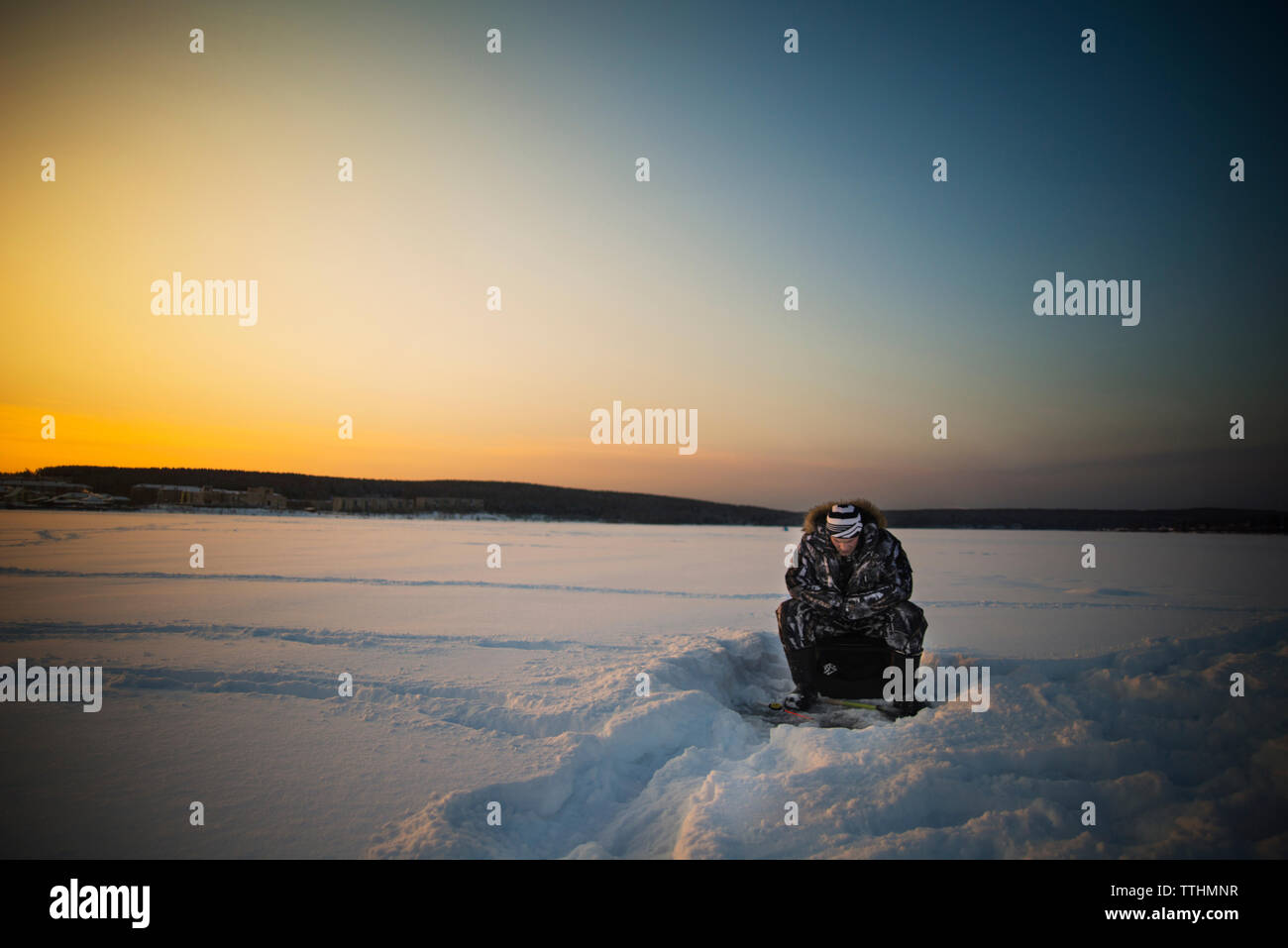 Man sitting on ice hi-res stock photography and images - Alamy