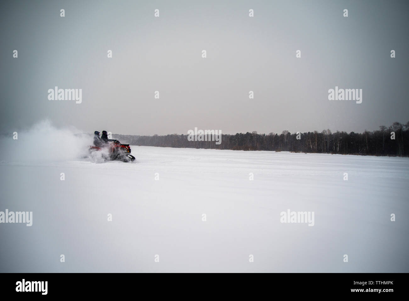Friends on snowmobile hi-res stock photography and images - Alamy