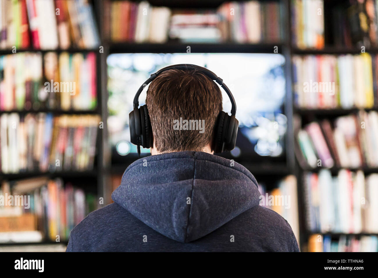 Teenager playing video game on tv hi-res stock photography and images ...