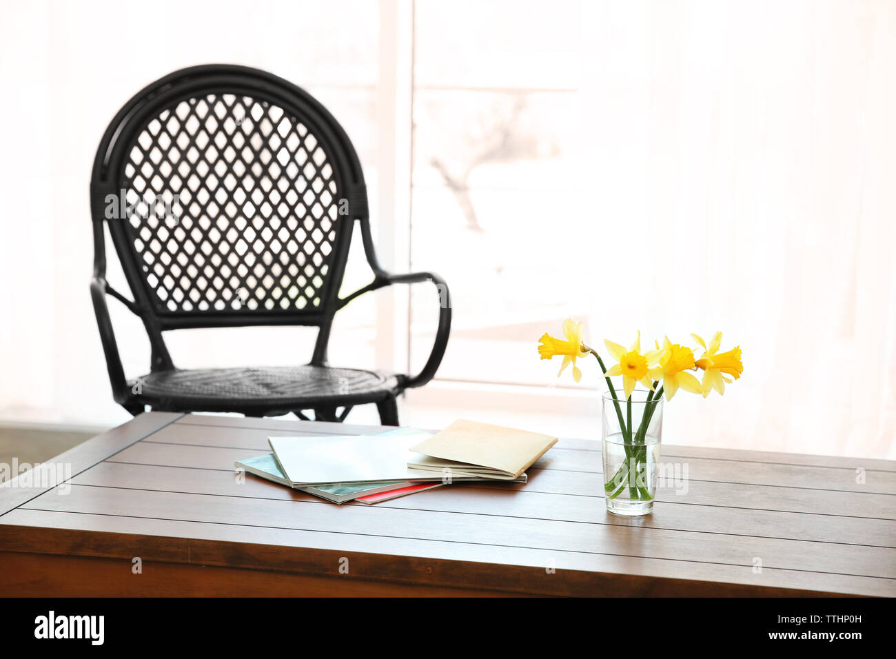 Modern living room interior. Chair beside a wooden table Stock Photo ...