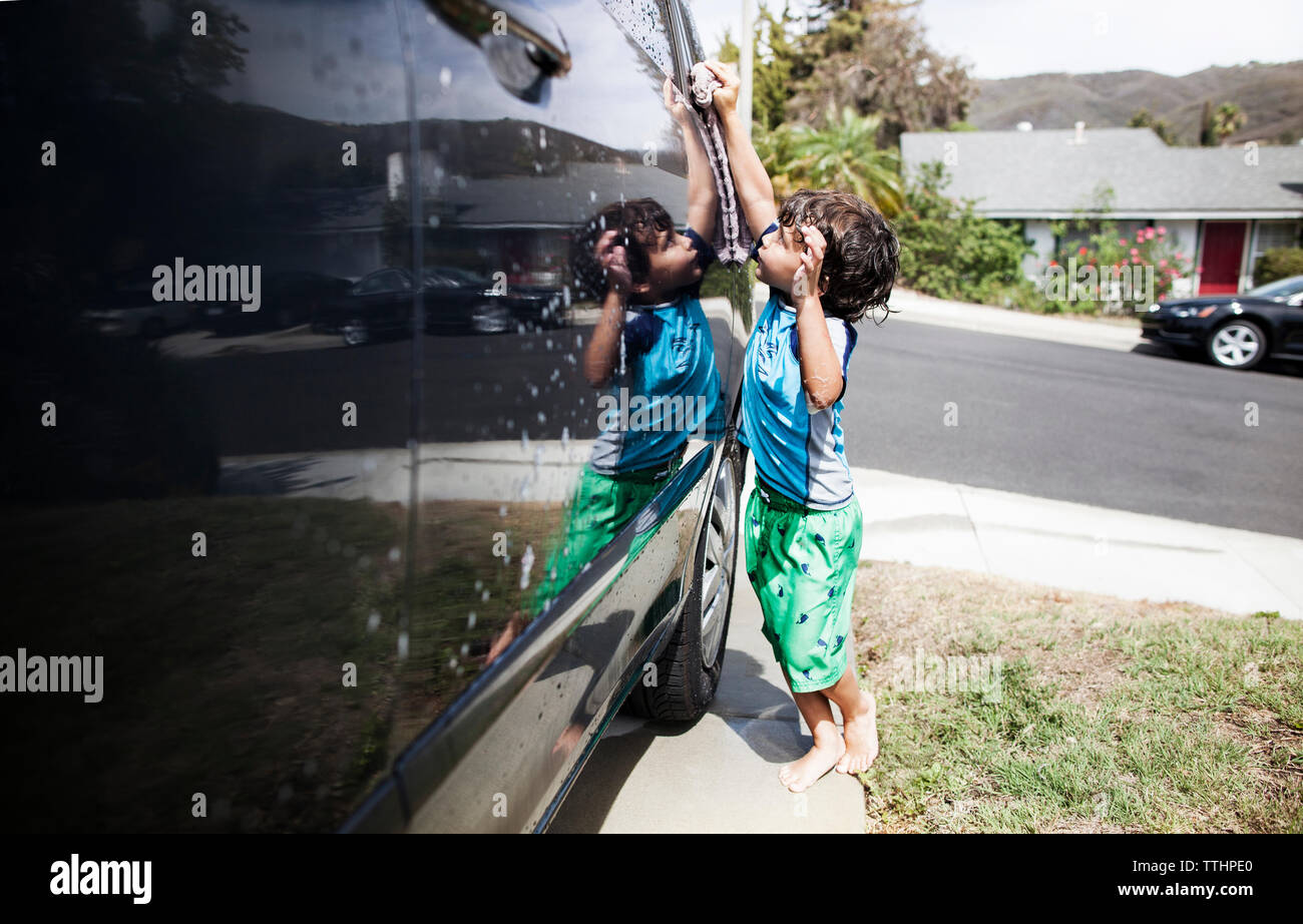 Boy washing car hi-res stock photography and images - Alamy