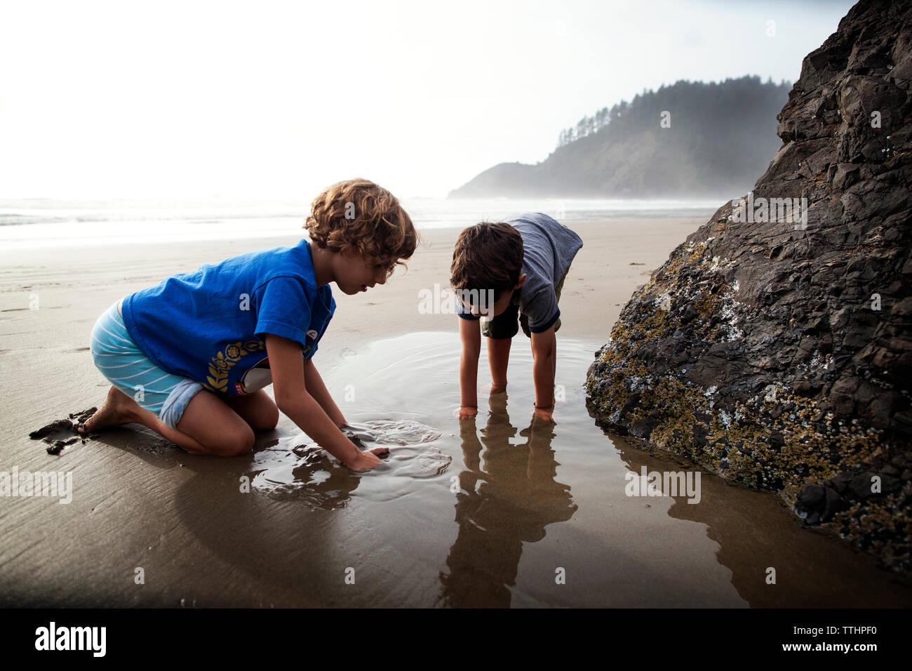 Playing beach sand hi-res stock photography and images - Alamy
