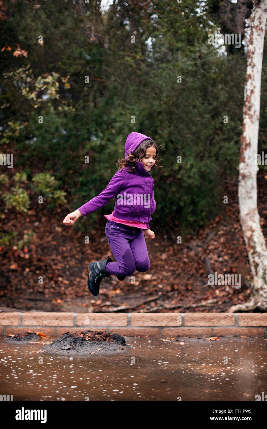 Jumping over puddle hi-res stock photography and images - Alamy