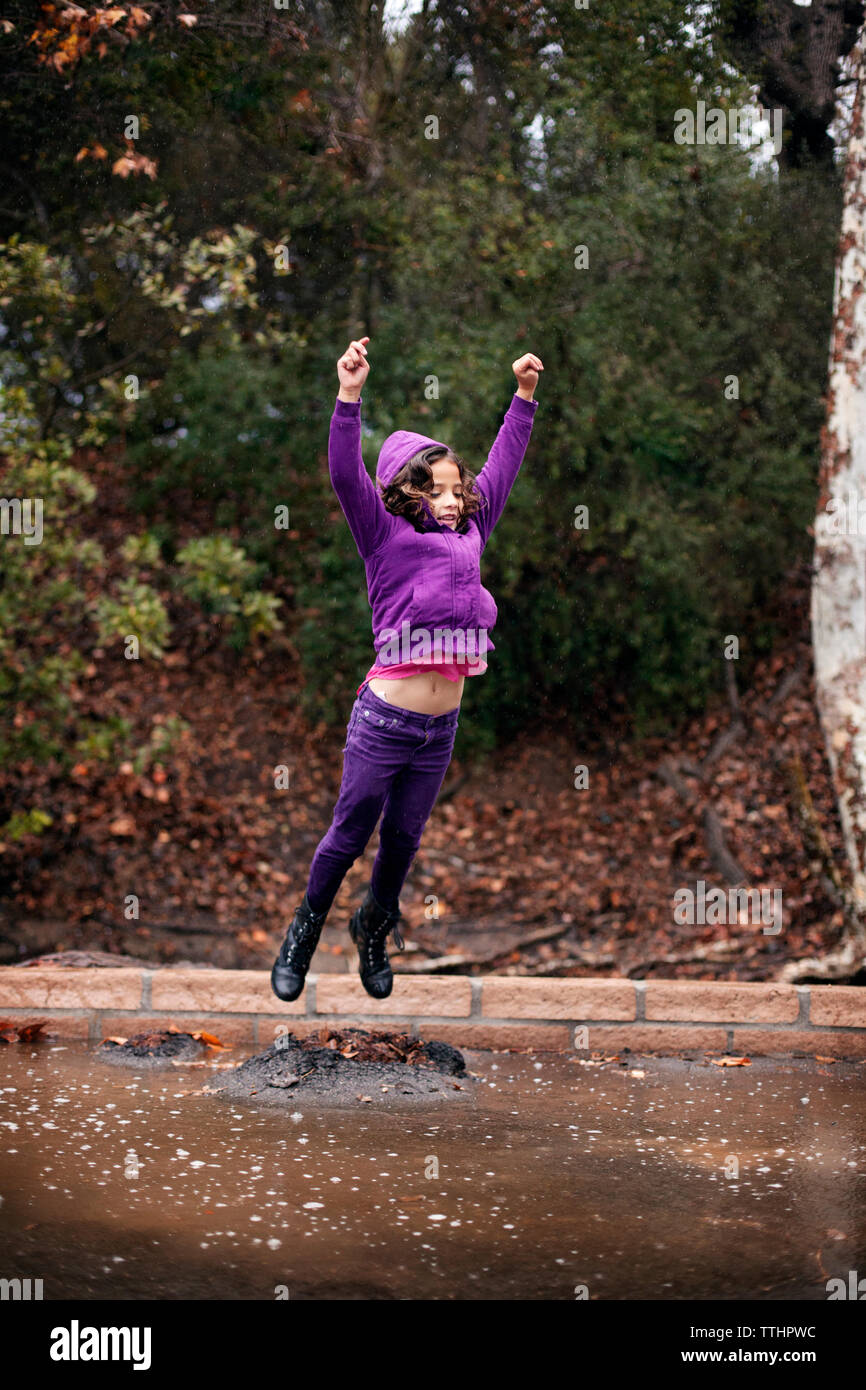 Jumping over puddle hi-res stock photography and images - Alamy