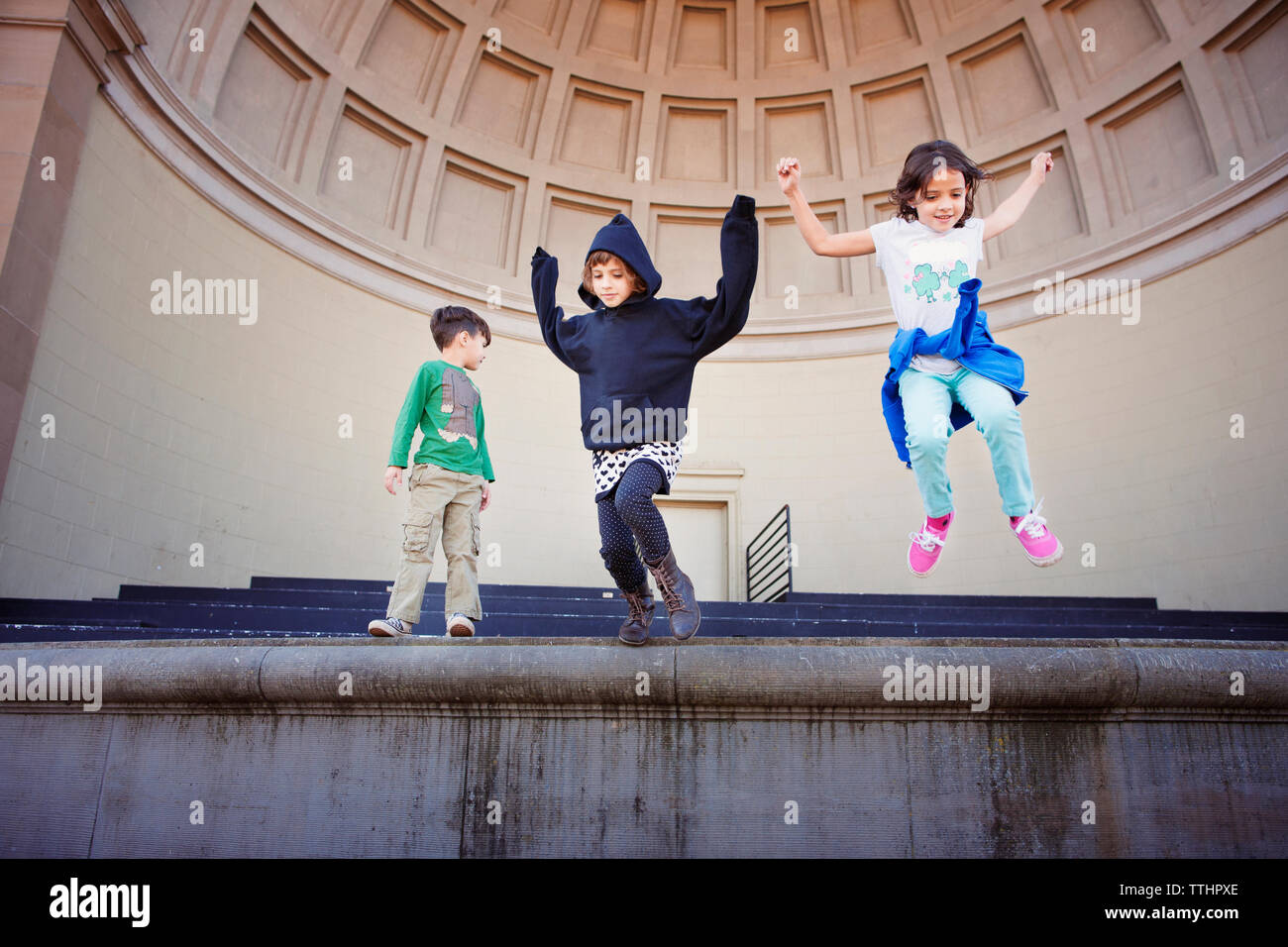Children jumping hi-res stock photography and images - Alamy