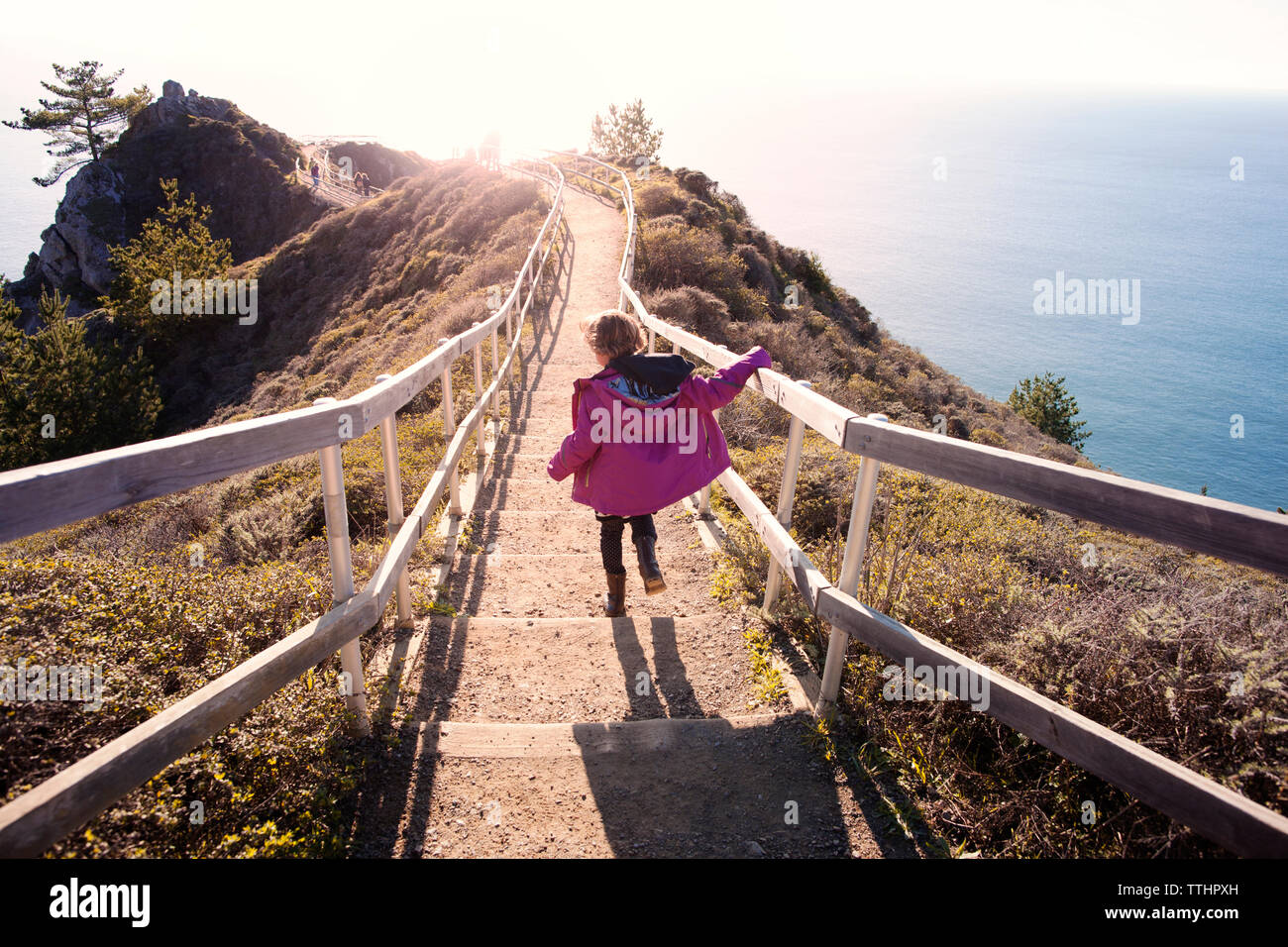 Girl walking down steps hi-res stock photography and images - Alamy