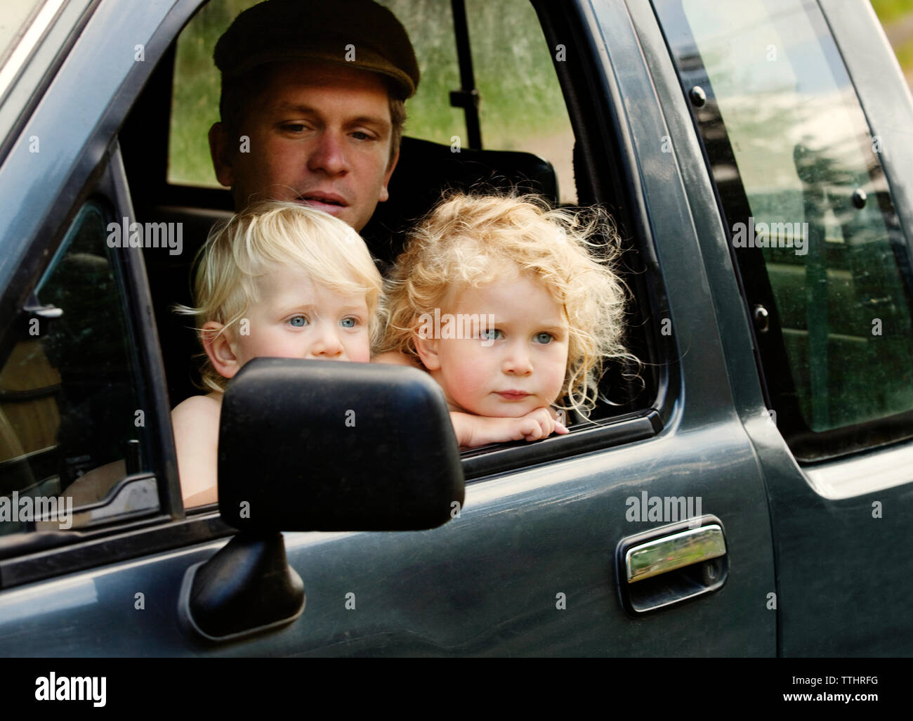 Father with children in pick-up truck Stock Photo - Alamy