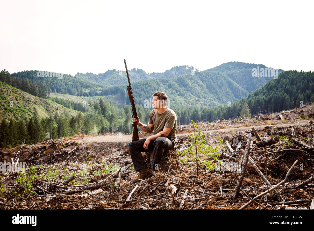 Hunter holding rifle looking away hi-res stock photography and images ...