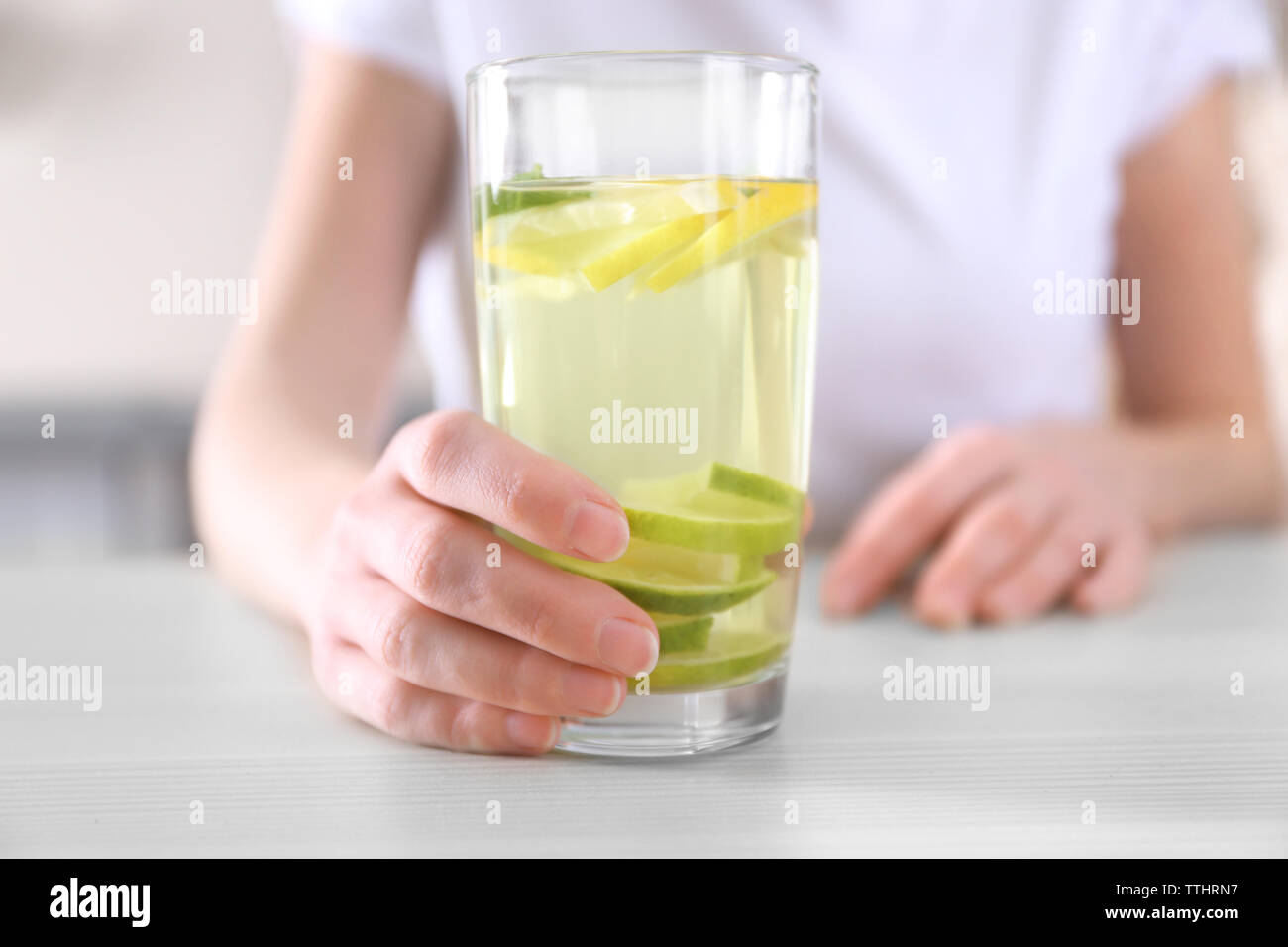 Female hand holding glass of lemonade closeup Stock Photo - Alamy