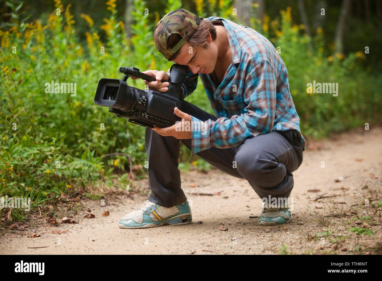 Filming camera man full length hi-res stock photography and images - Alamy