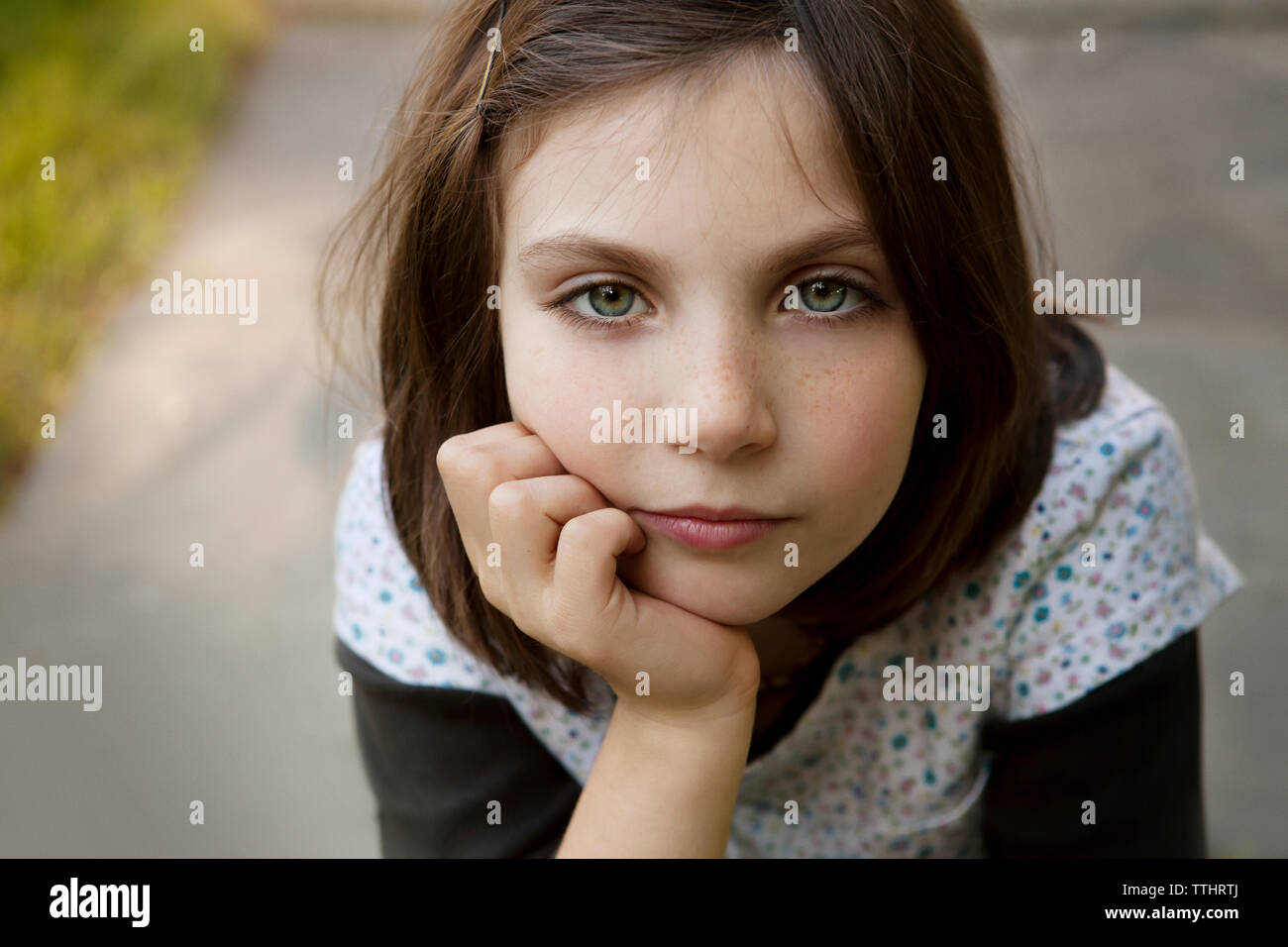 Hand on chin girl serious hi-res stock photography and images - Alamy