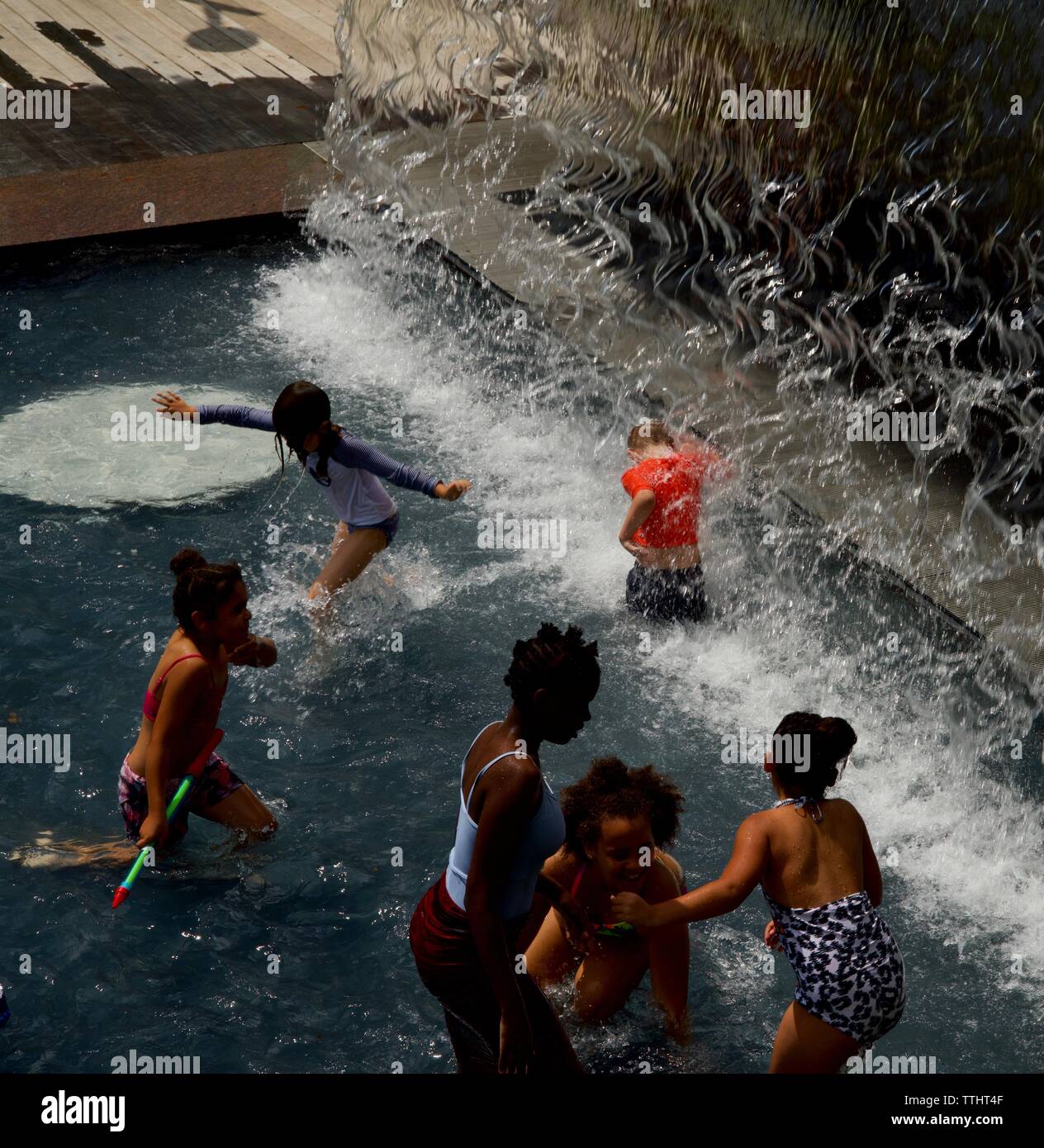 Kids getting wet hi-res stock photography and images - Alamy