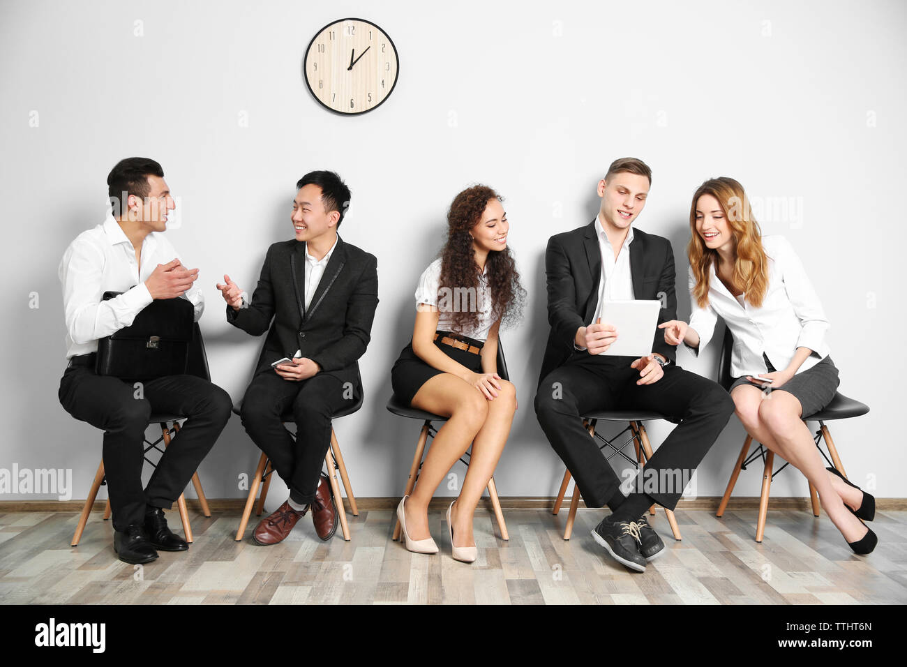 Group of people waiting for interview indoors Stock Photo - Alamy