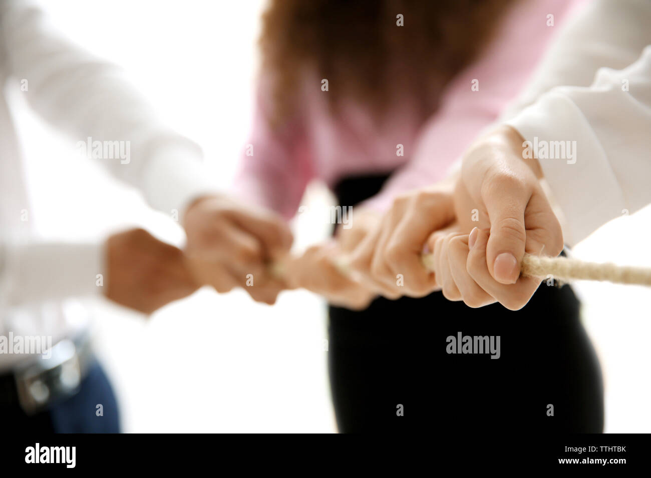 Hands pulling rope hi-res stock photography and images - Alamy
