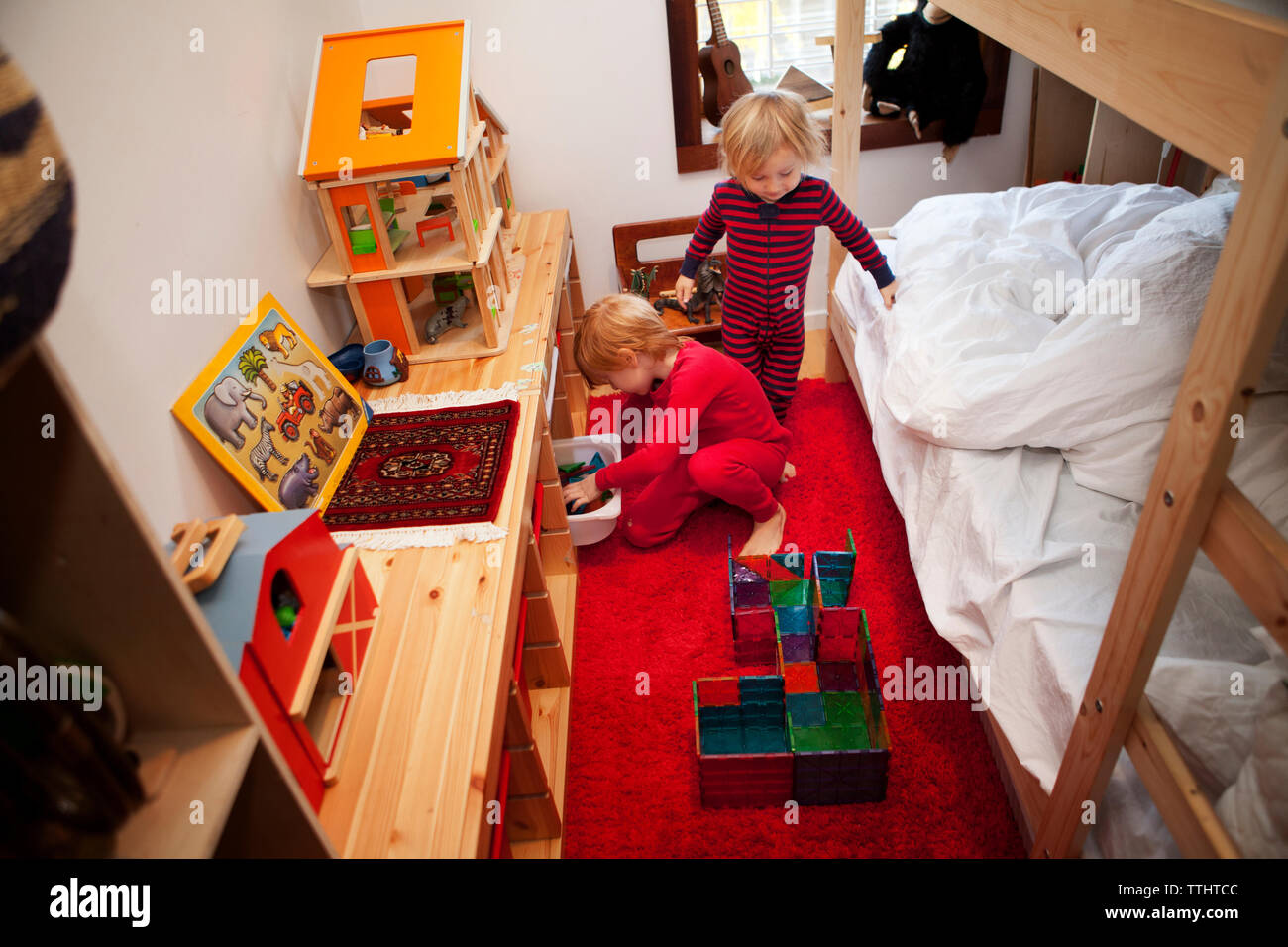 Children arranging toys in bedroom Stock Photo - Alamy