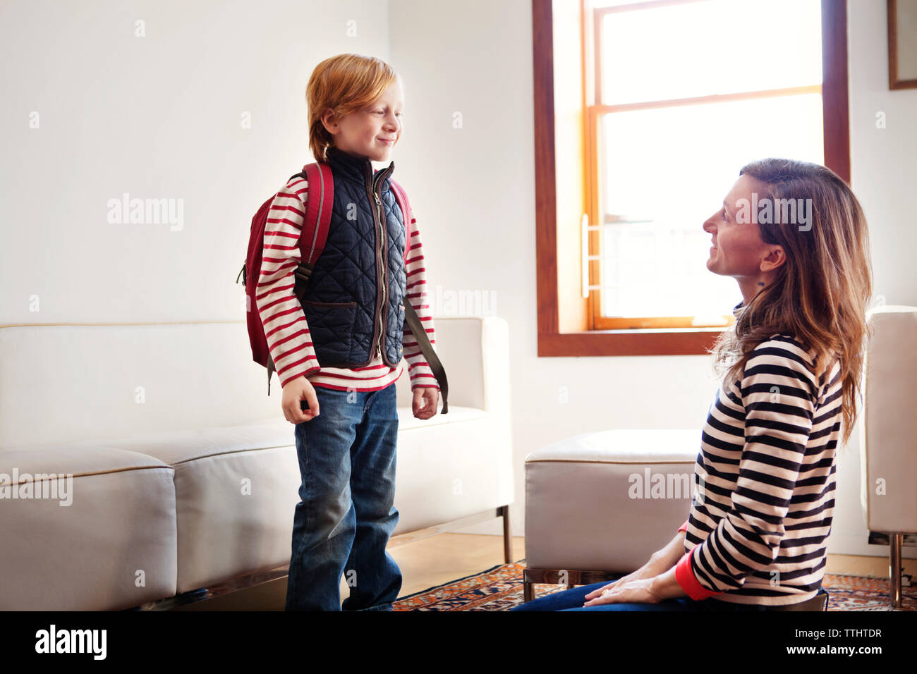 Cute boy backpack holding hi-res stock photography and images - Alamy