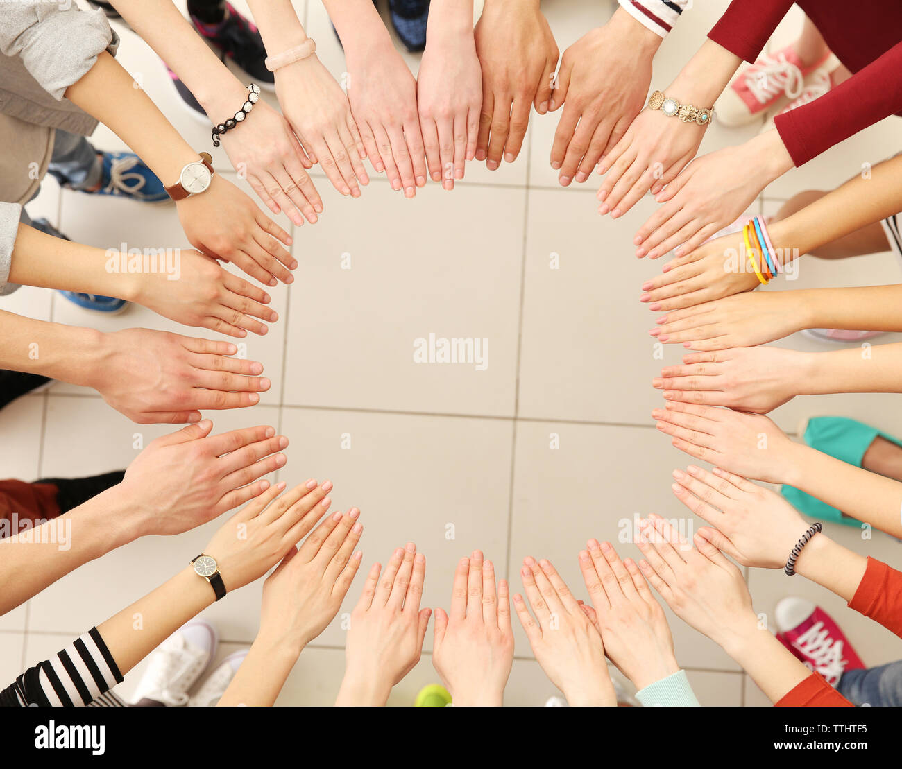 Group of people hands together Stock Photo - Alamy