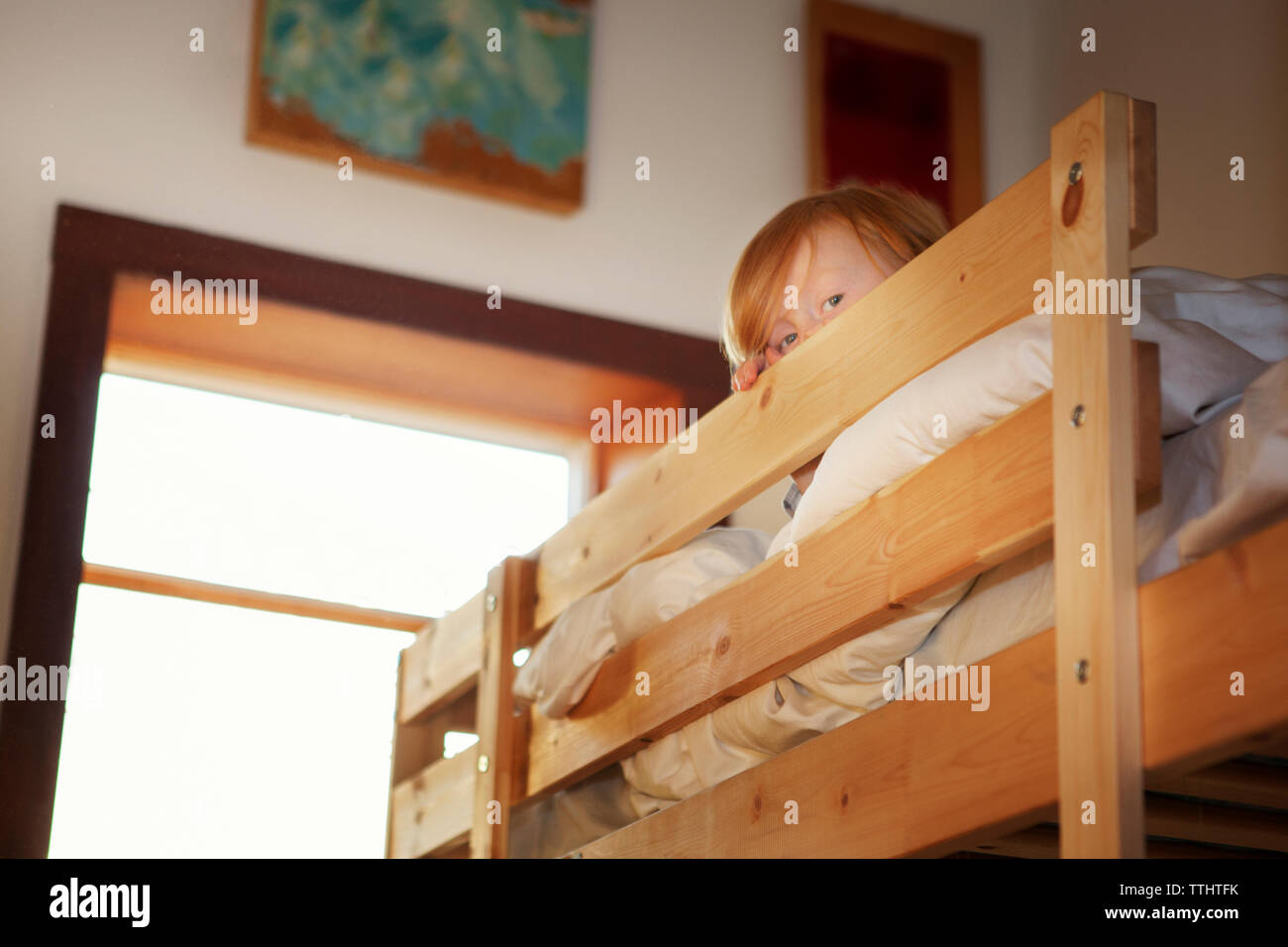 Portrait of boy on bunked at home Stock Photo - Alamy
