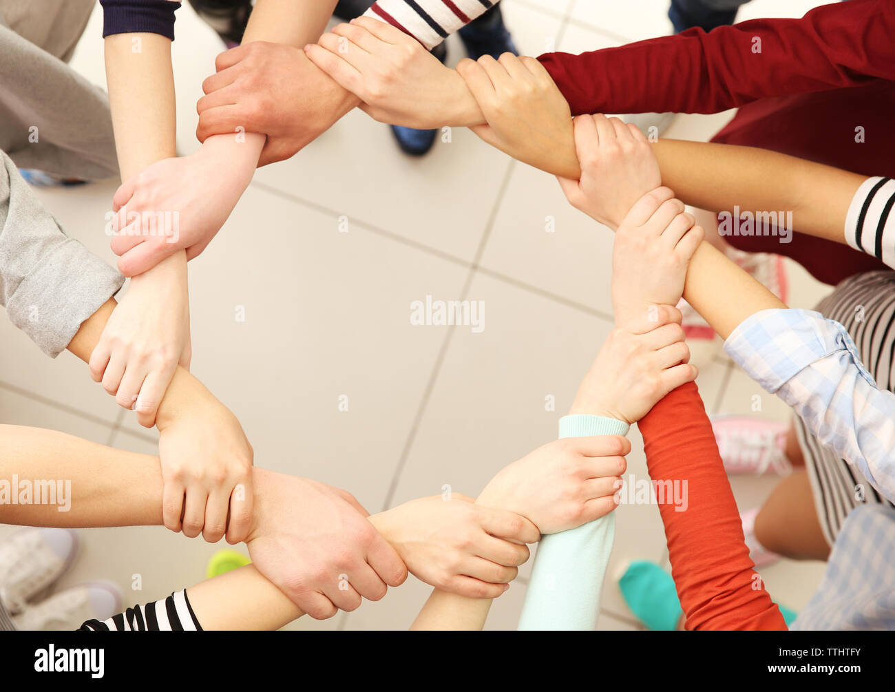 Group of people hands together Stock Photo - Alamy