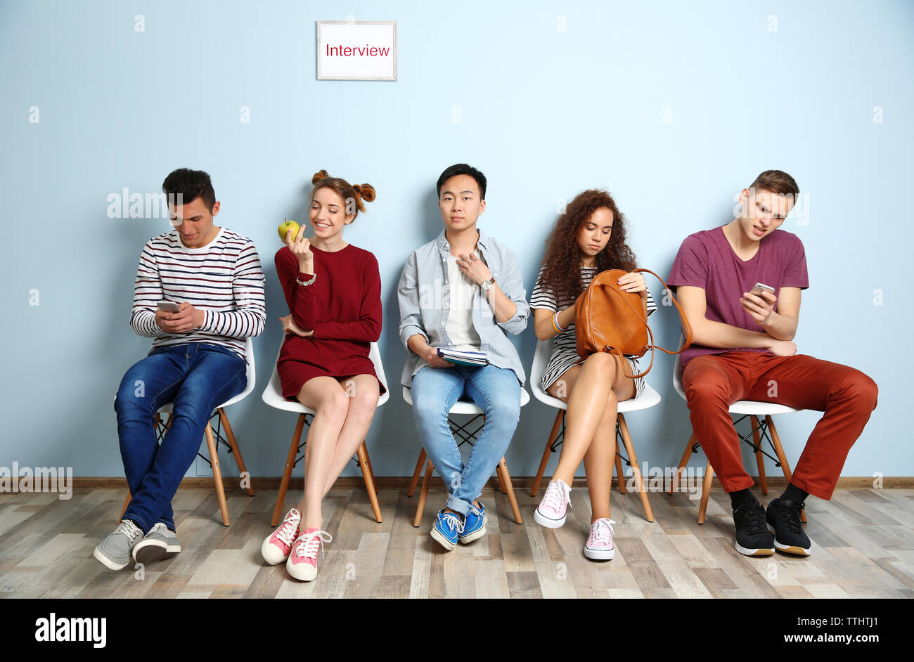 Group of people waiting for interview indoors Stock Photo - Alamy