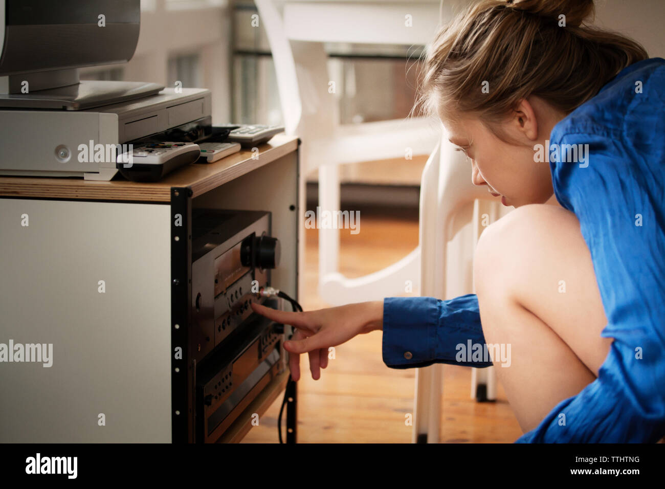 Woman playing VCR player at home Stock Photo - Alamy
