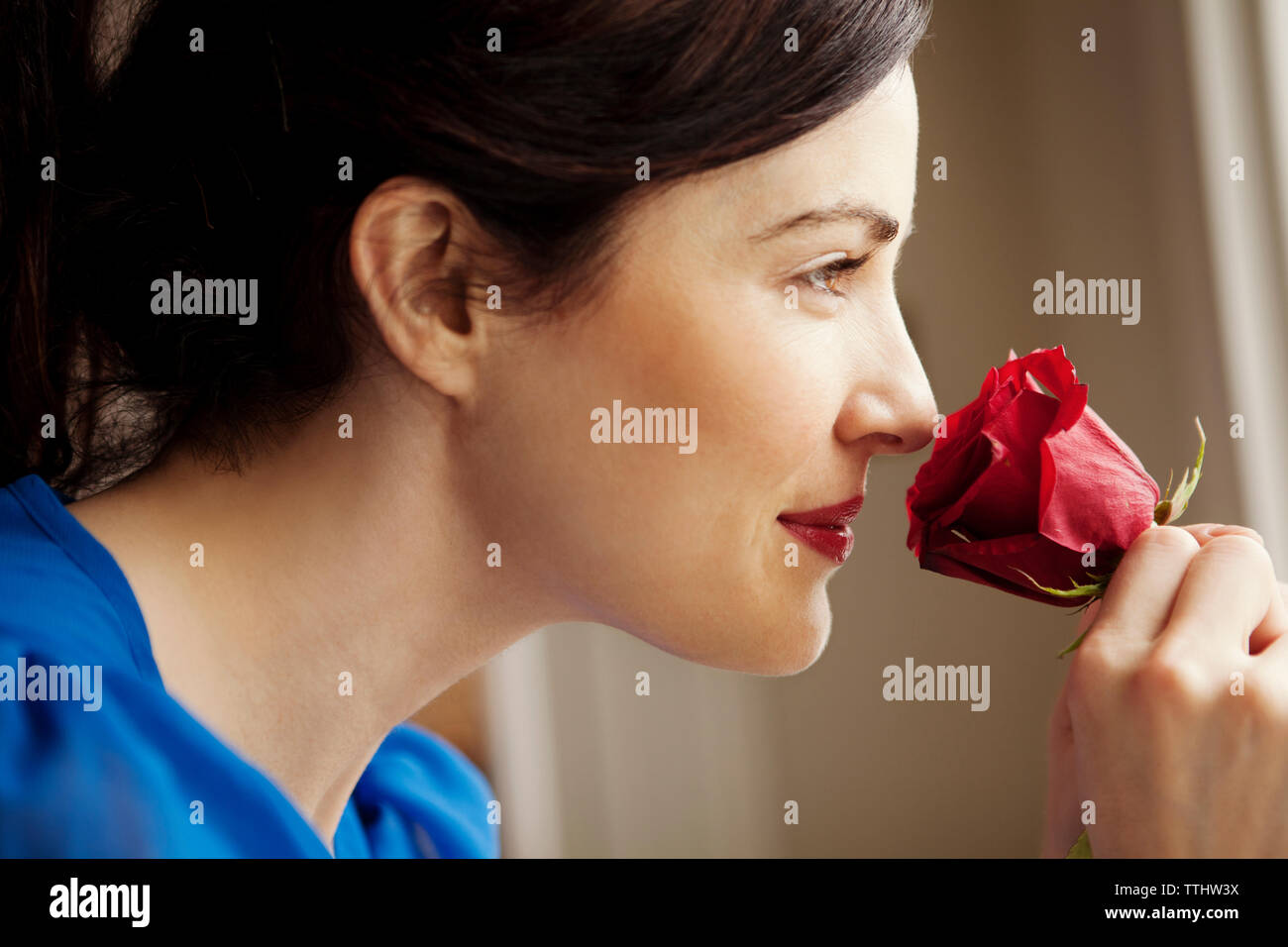 Old person smelling flower hi-res stock photography and images - Alamy