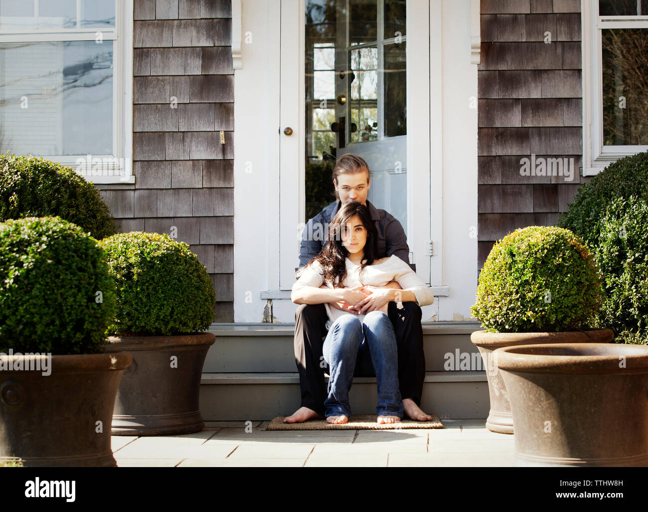 Man woman sitting on stoop hi-res stock photography and images - Alamy