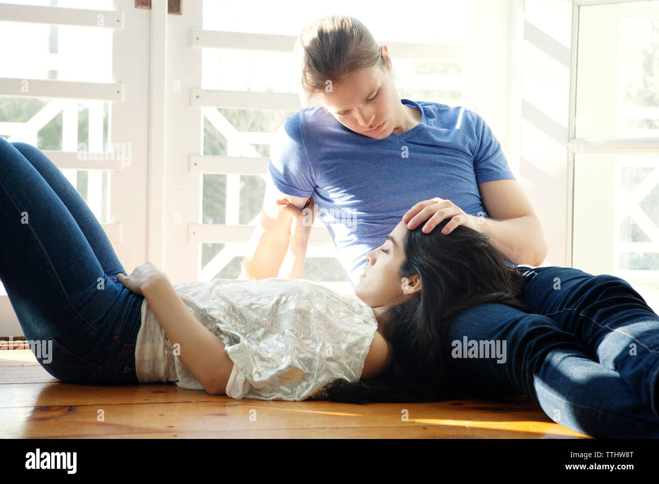 Young woman sitting on mans lap hi-res stock photography and images - Alamy